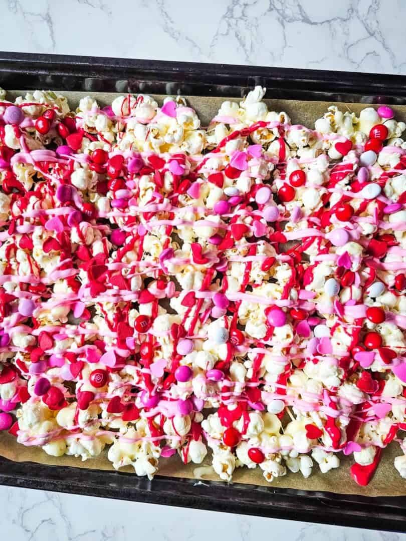 Red & Pink Candy Coated Popcorn Recipe With M&Ms · Artsy Fartsy Life