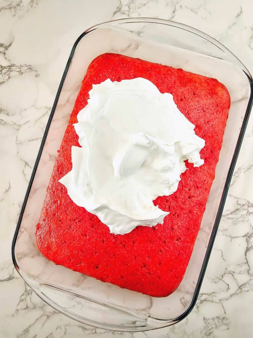 Cherry Jello Poke Cake Recipe With Dream Whip frosting · Artsy Fartsy Life